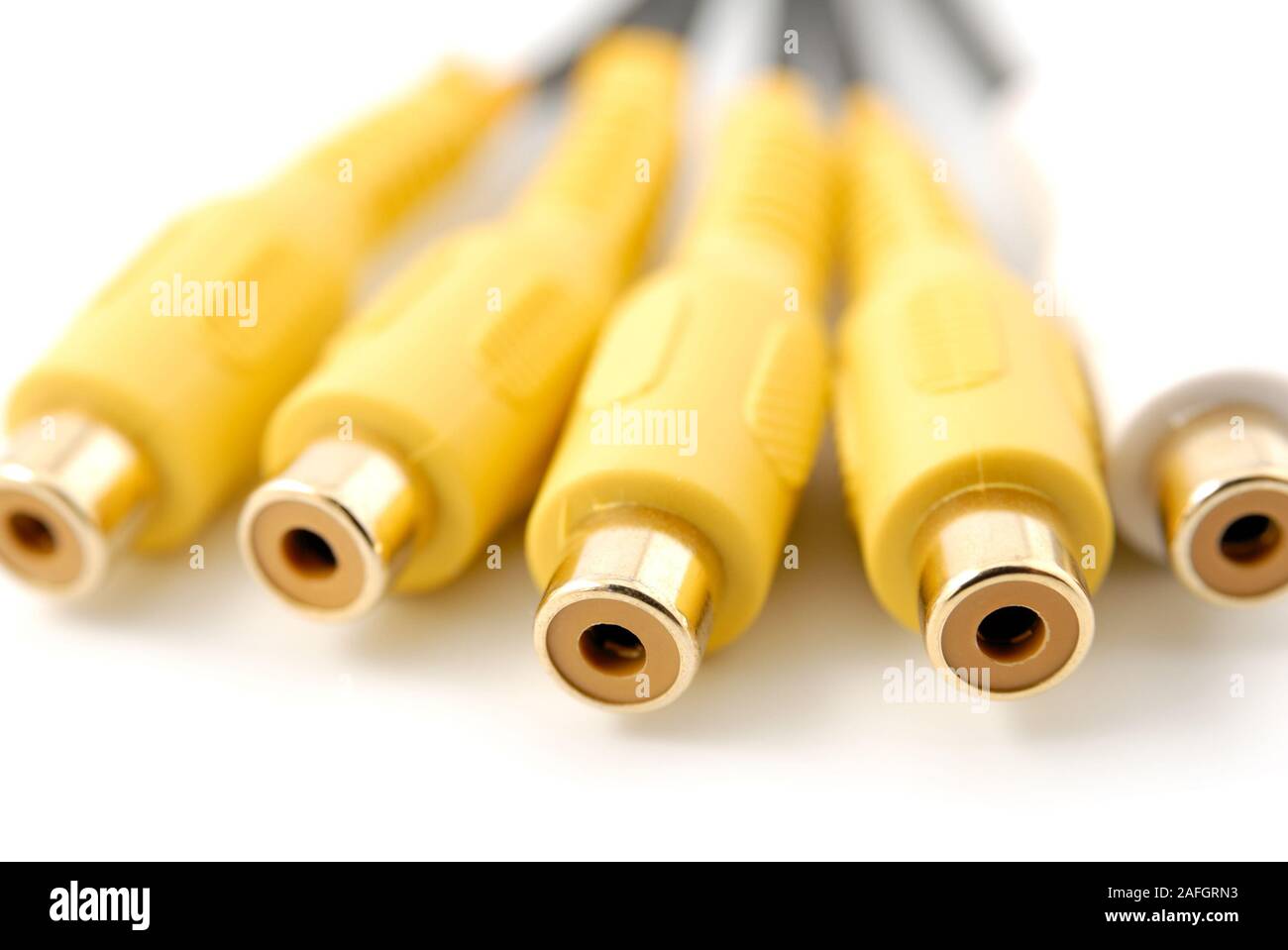 Yellow white RCA audio video plug connectors on a white background ...