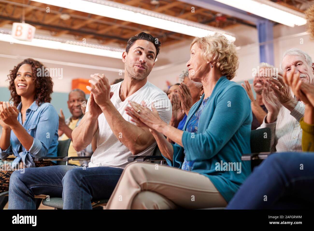 Group Attending Neighborhood Meeting In Community Center Clapping Stock ...