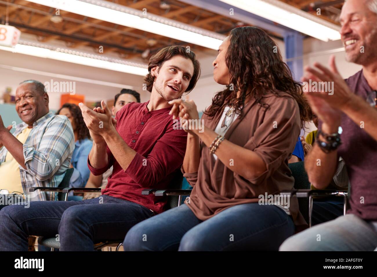 Group Attending Neighborhood Meeting In Community Center Clapping Stock ...