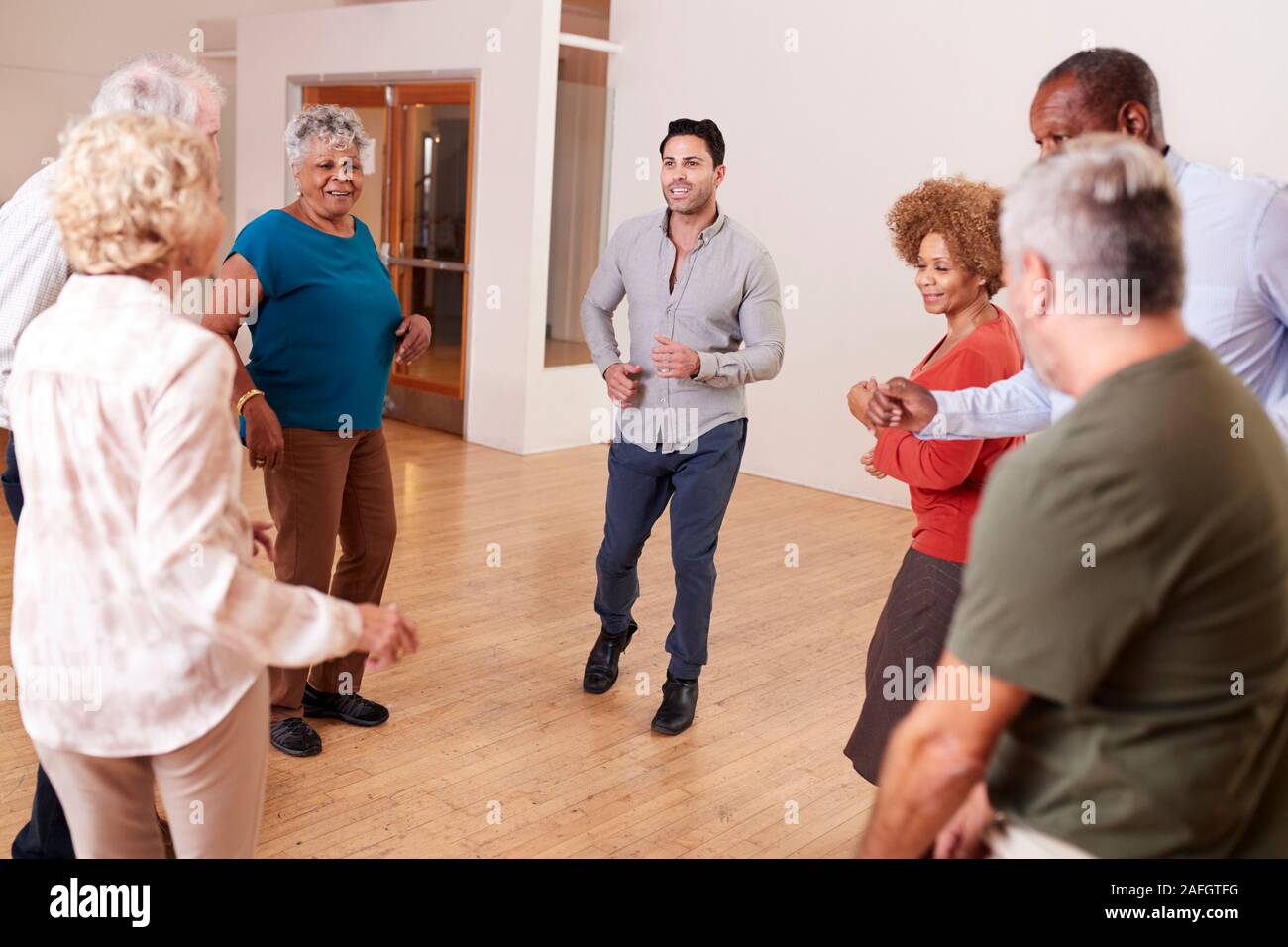 People Attending Dance Class In Community Center Stock Photo - Alamy