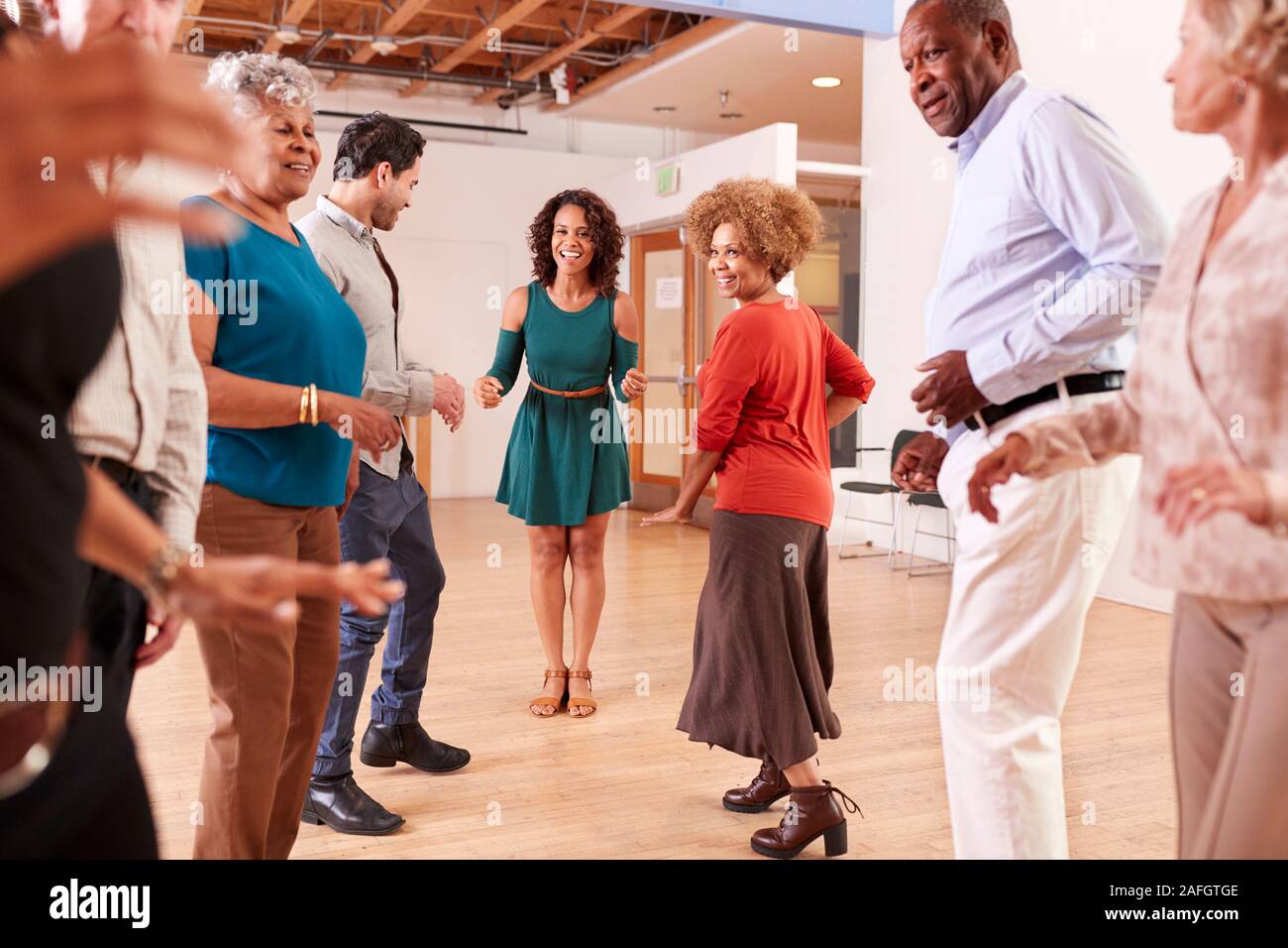 People Attending Dance Class In Community Center Stock Photo - Alamy