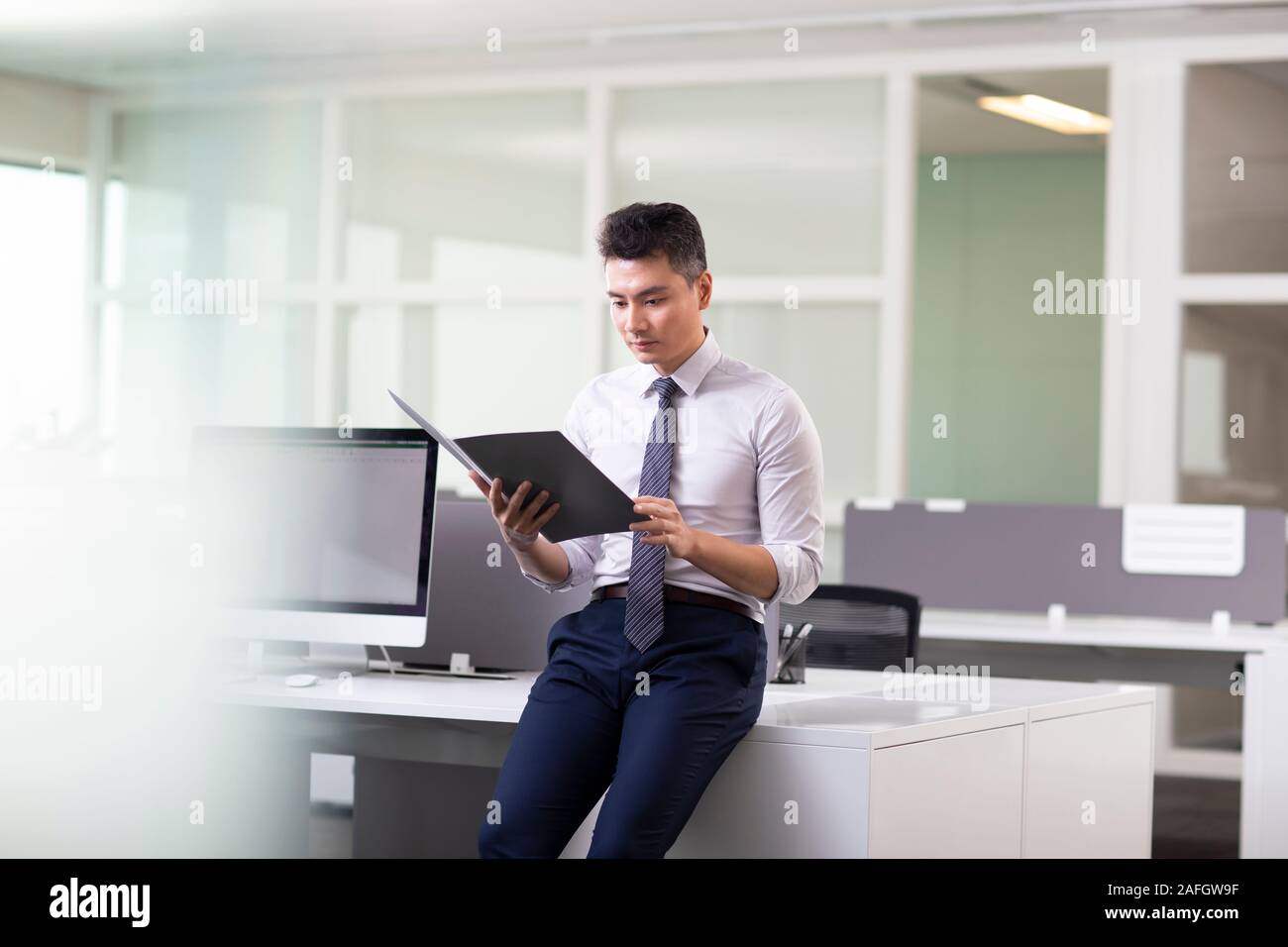 Sitting holding reading concentration authority hi-res stock ...