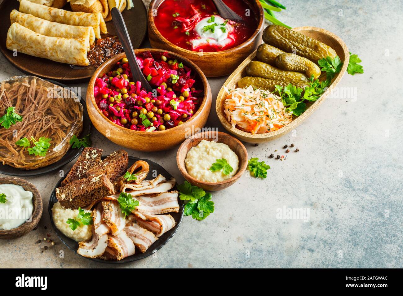 Traditional Russian cuisine concept. Borsch, jellied meat, bacon ...