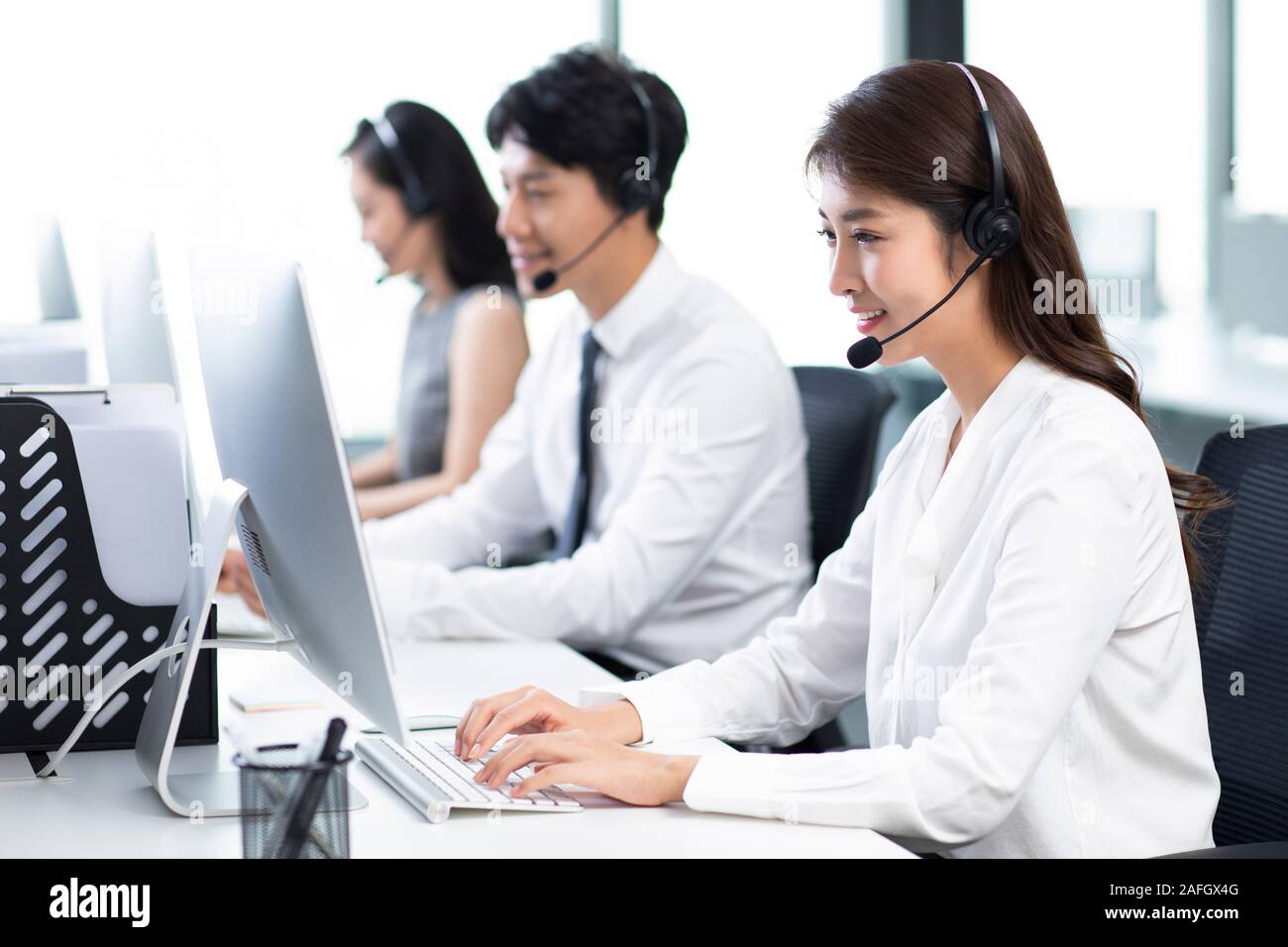 Professional customer service staff in office Stock Photo - Alamy