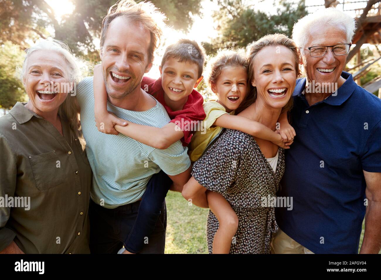 Father carrying teenage daughter piggyback hi-res stock photography and ...