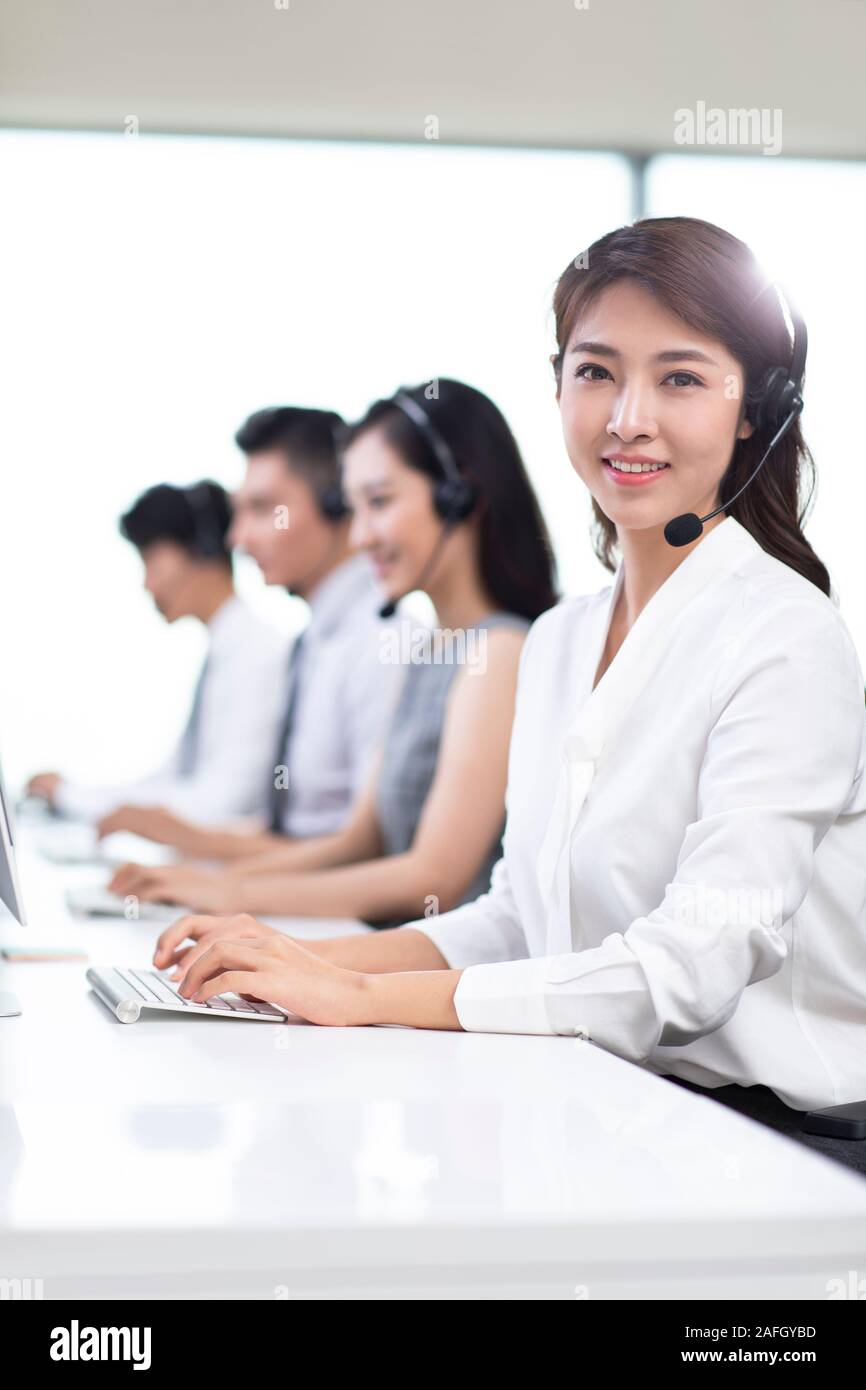 Professional customer service staff in office Stock Photo - Alamy