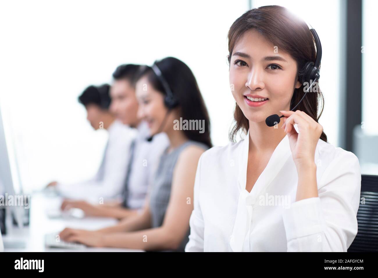 Professional customer service staff in office Stock Photo - Alamy