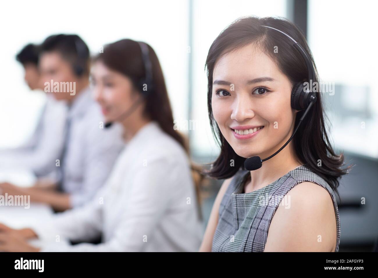 Professional customer service staff in office Stock Photo - Alamy