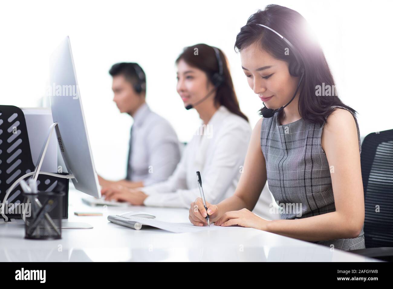 Professional customer service staff in office Stock Photo - Alamy