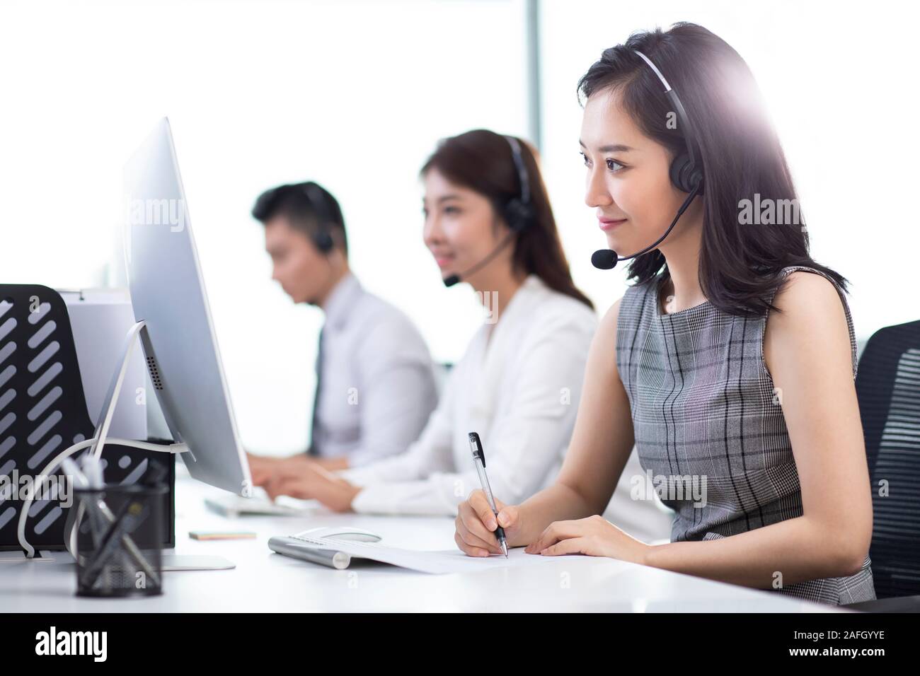 Professional customer service staff in office Stock Photo - Alamy