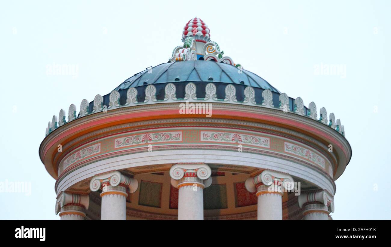 Colorful building with a dome and columns in the English Garden in ...
