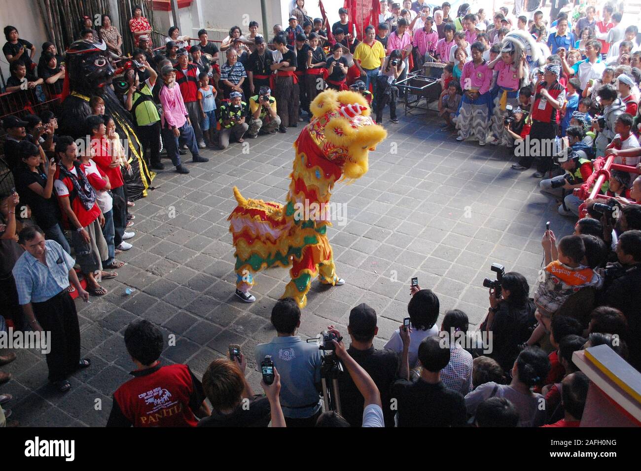 Lion dance puppet show and the crowd in Chinese New Year Festival Stock ...