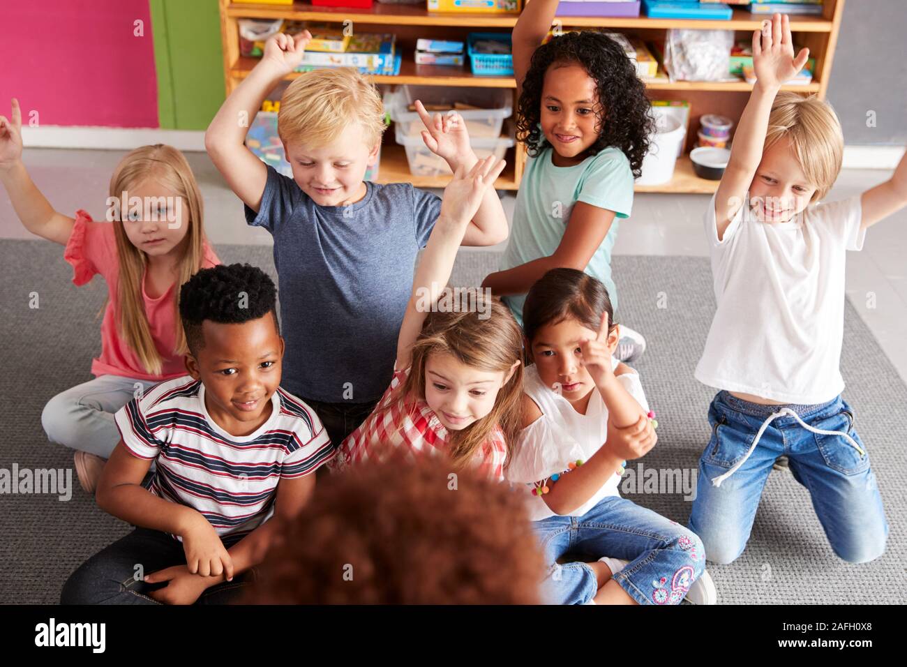 Children hands raised classroom hi-res stock photography and images - Alamy