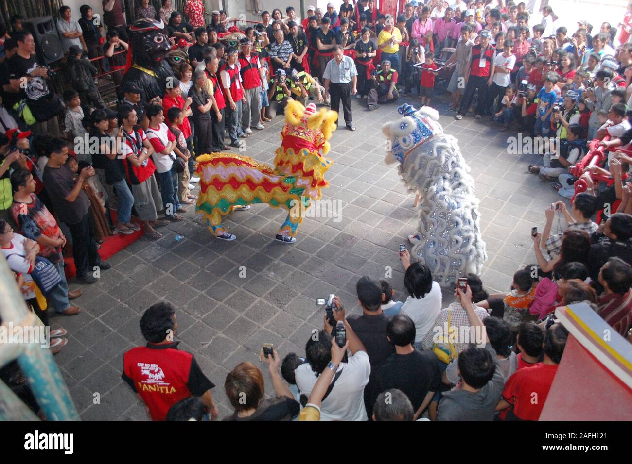 Lion dance puppet show and the crowd in Chinese New Year Festival Stock ...