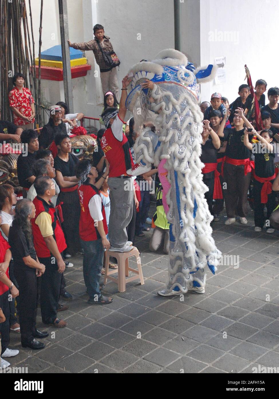 Lion dance puppet show and the crowd in Chinese New Year Festival Stock ...