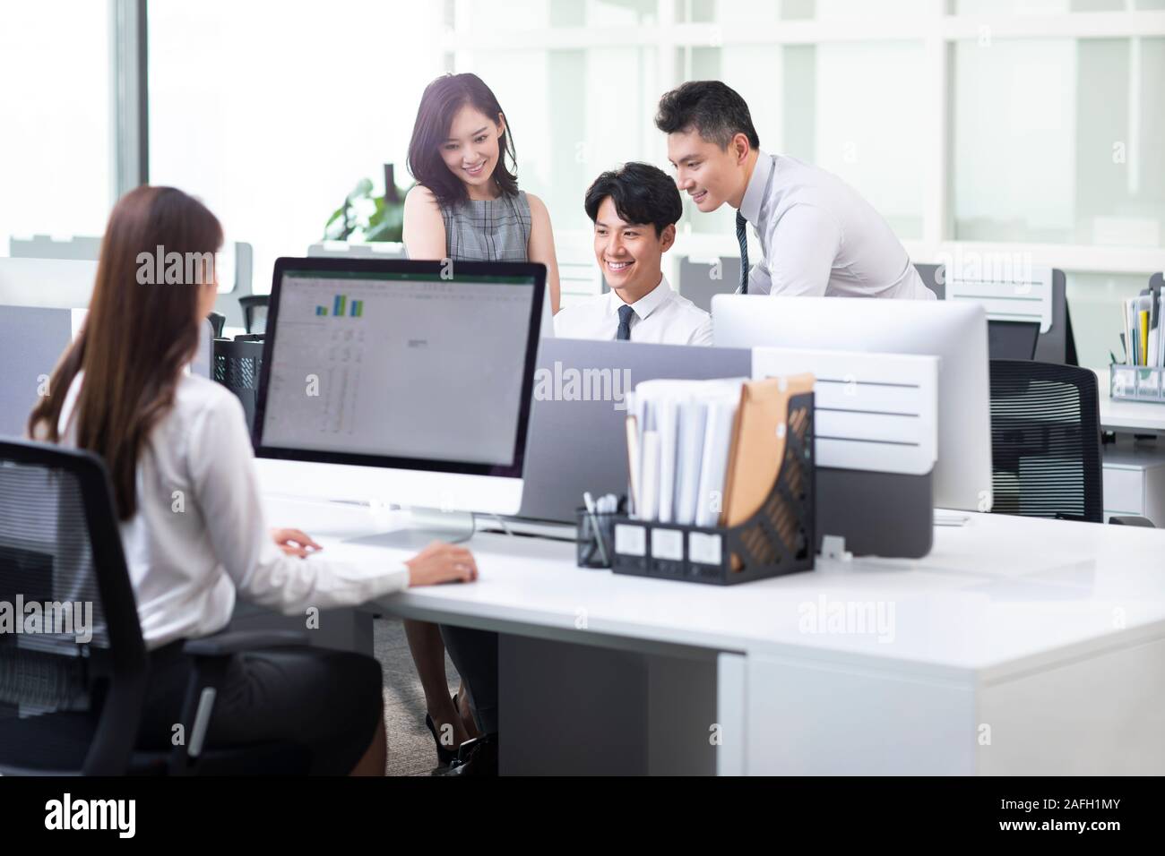 Business people using computers in office Stock Photo - Alamy