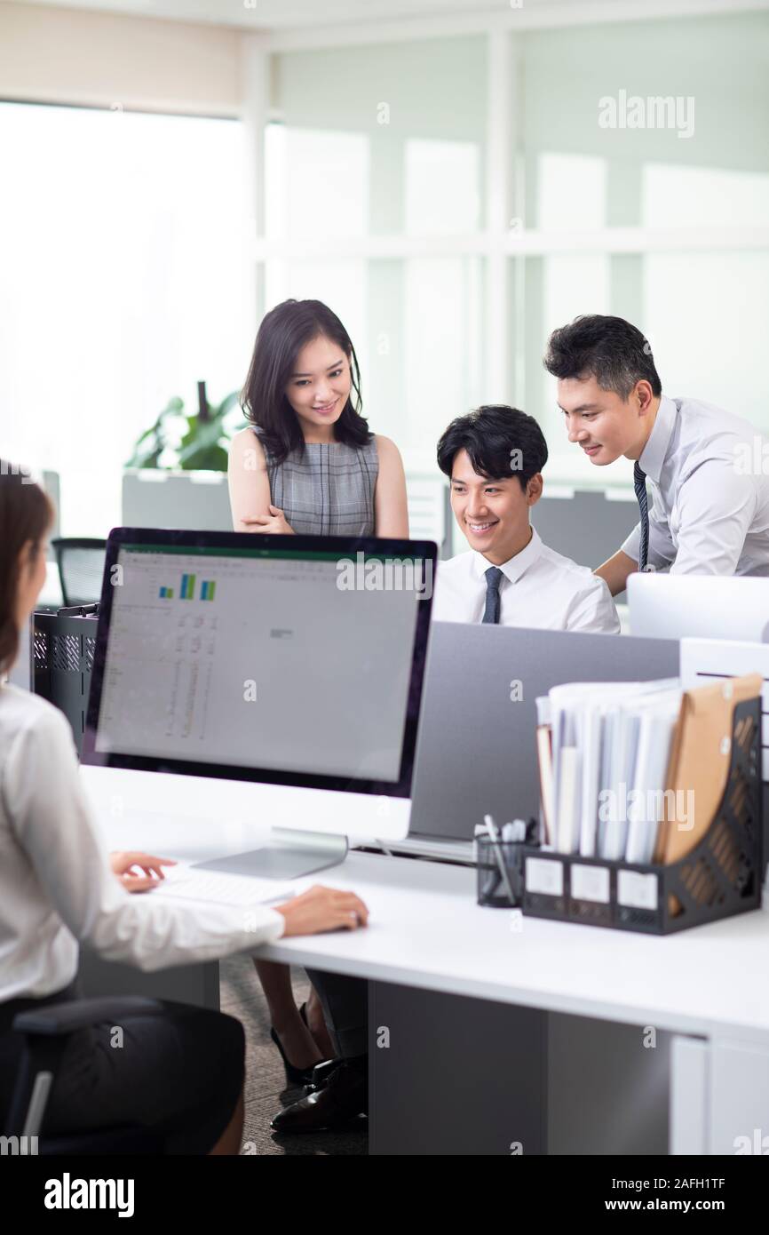 Business people using computers in office Stock Photo - Alamy