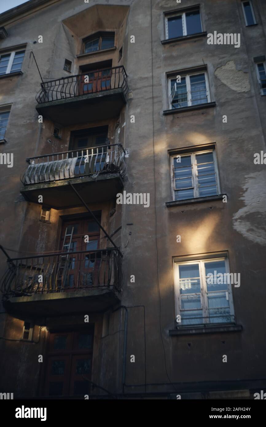 Vertical low angle shot of an old apartment building Stock Photo - Alamy