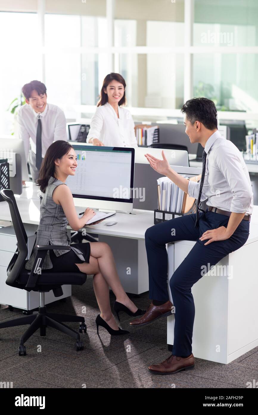 Successful business people talking in office Stock Photo - Alamy