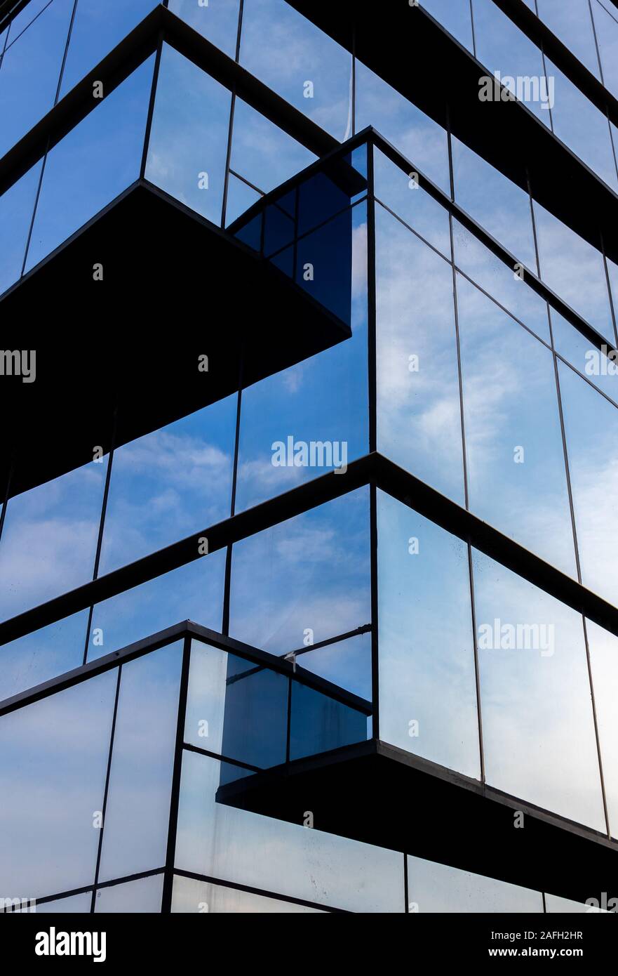 Vertical shot of a modern building in a glass facade Stock Photo - Alamy
