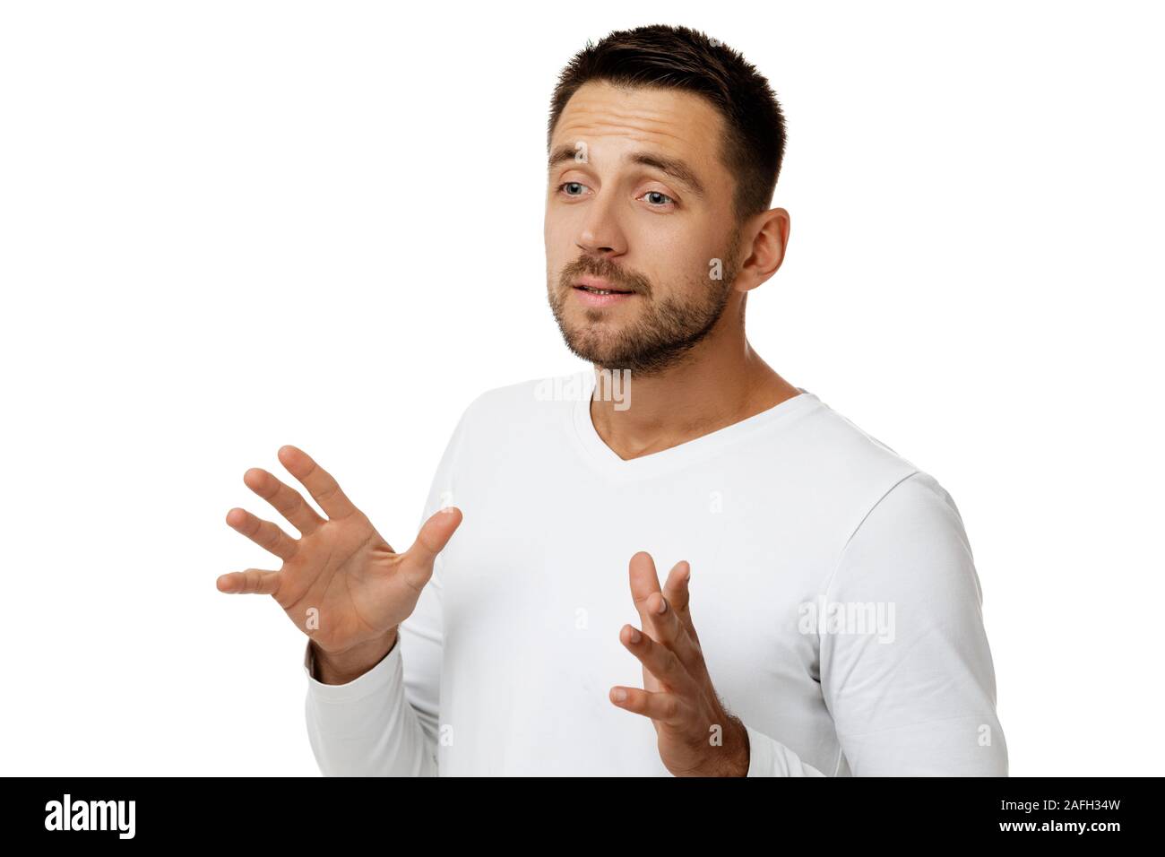 portrait of bearded man in casual white shirt telling something ...