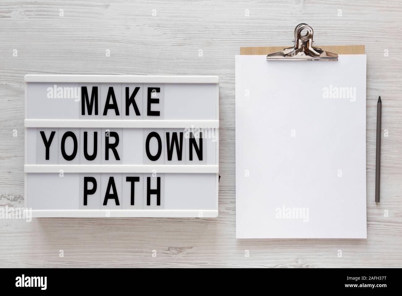 'Make your own path' words on a modern board, clipboard with blank ...