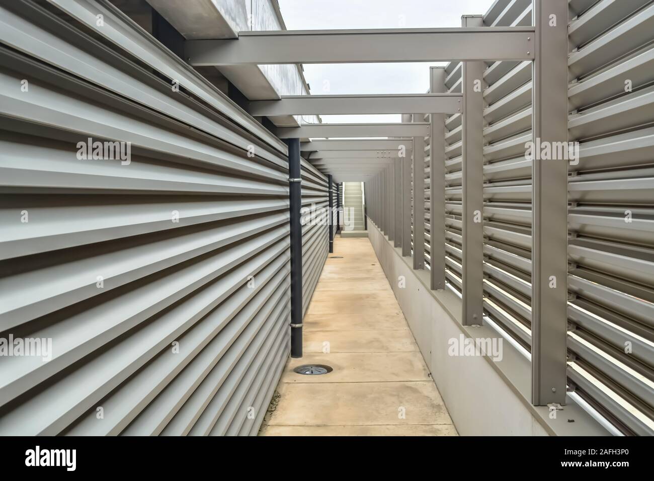 View of an aluminum-lined technical corridor for rooftop air ...