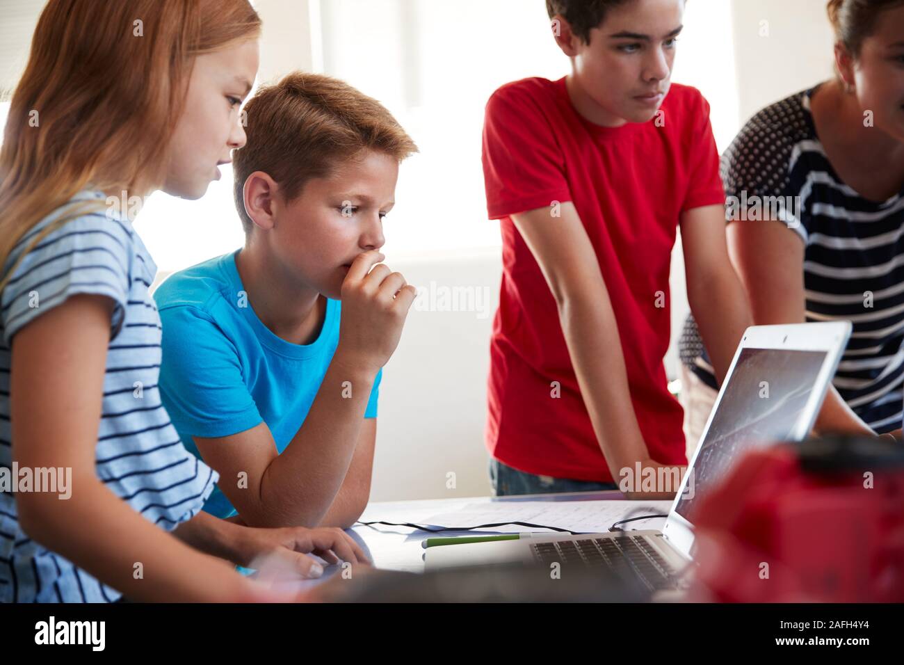 Group Of Students In After School Computer Coding Class Learning To ...