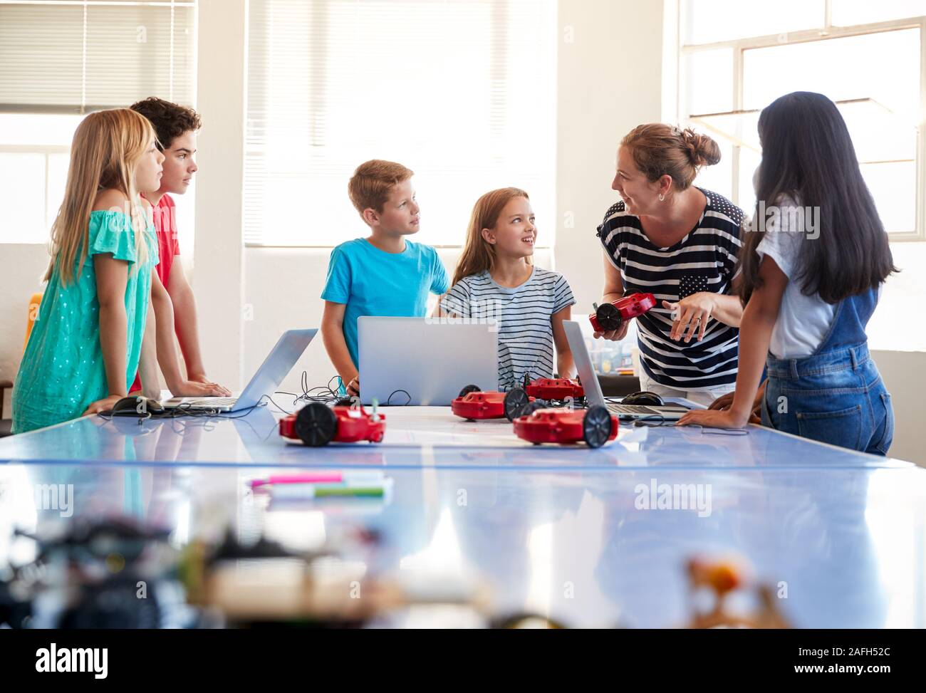Group Of Students In After School Computer Coding Class Learning To ...