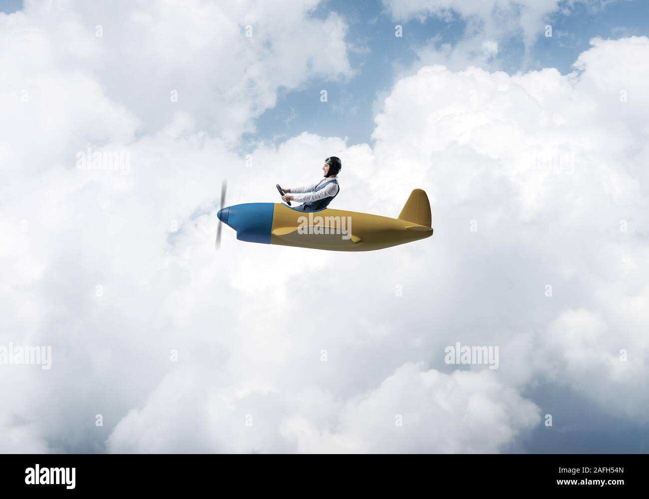 Happy pilot driving small propeller plane Stock Photo - Alamy