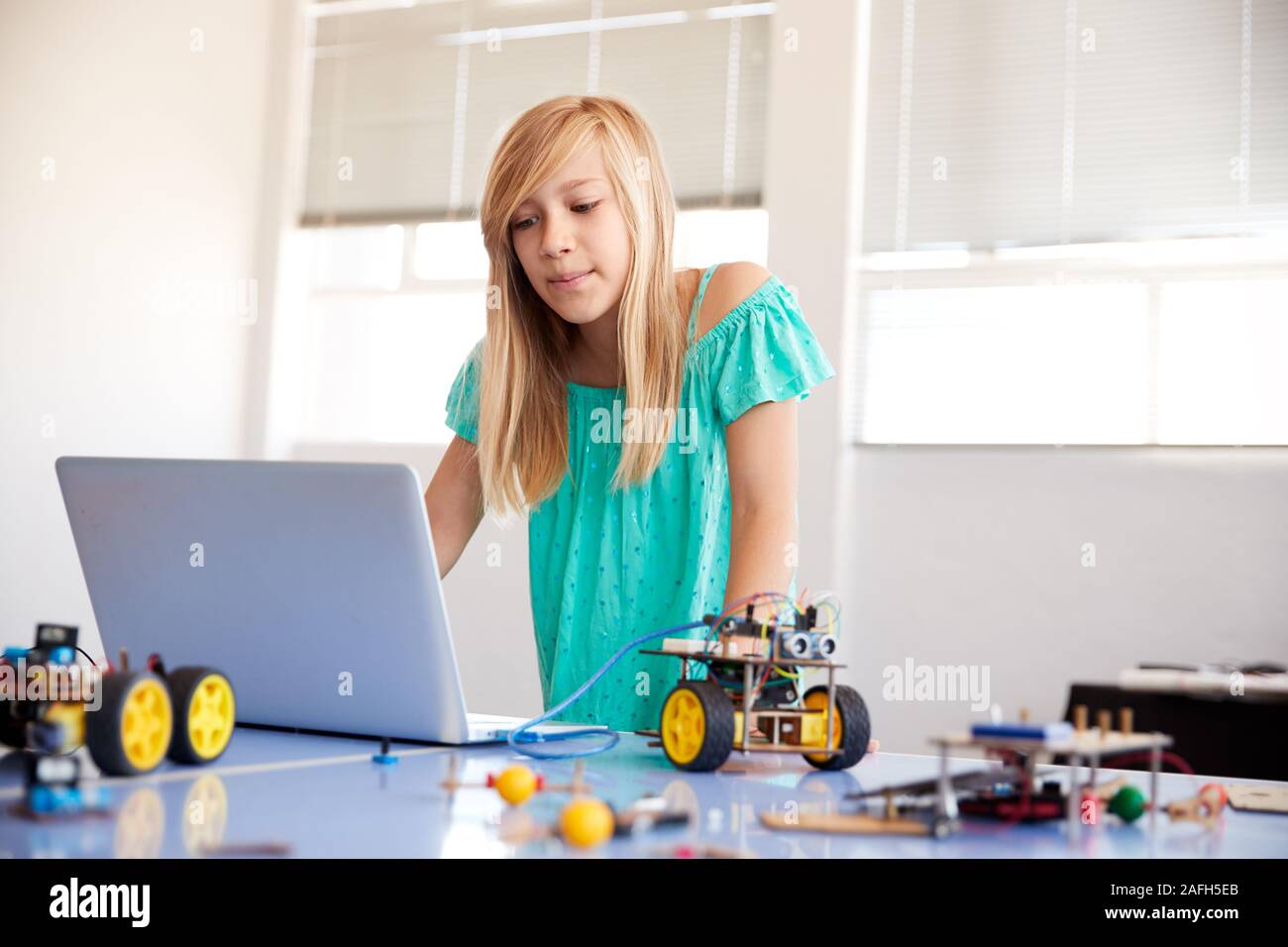 Female Student Building And Programing Robot Vehicle In After School ...