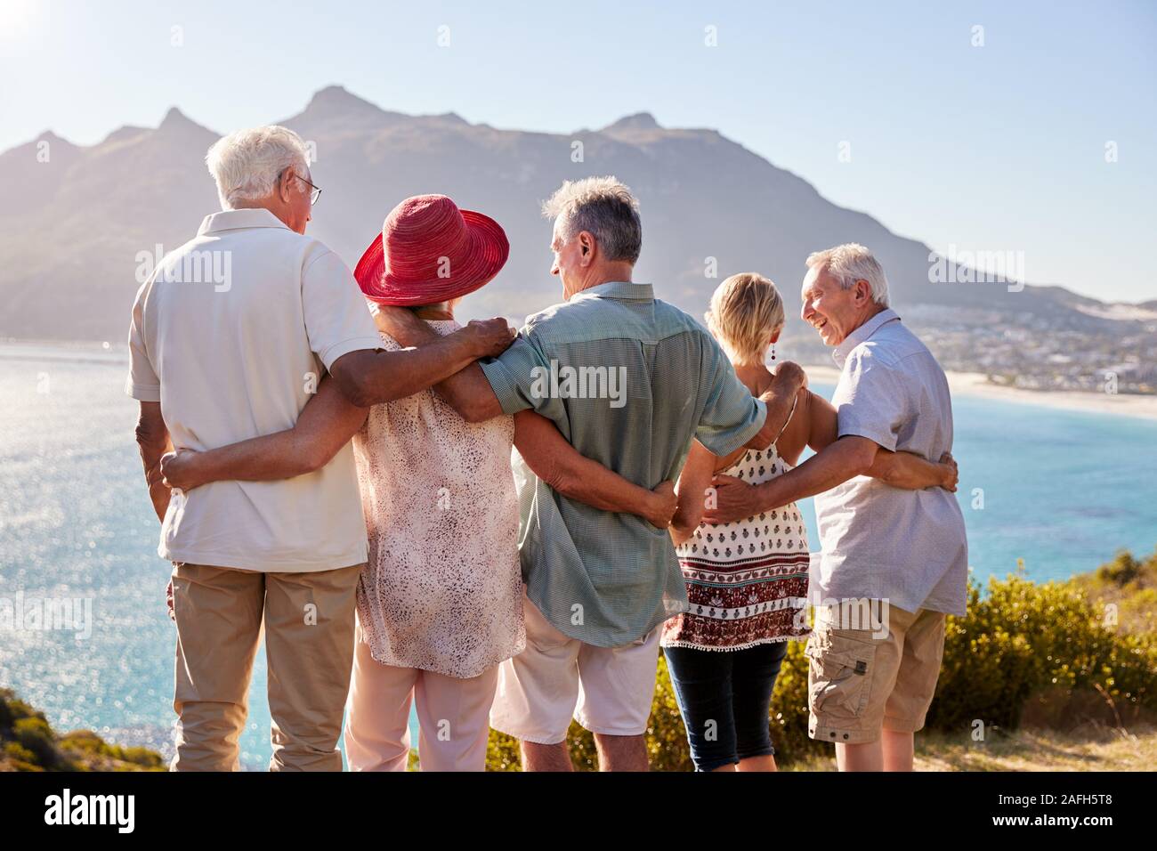 Rear View Of Senior Friends Visiting Tourist Landmark On Group Vacation ...
