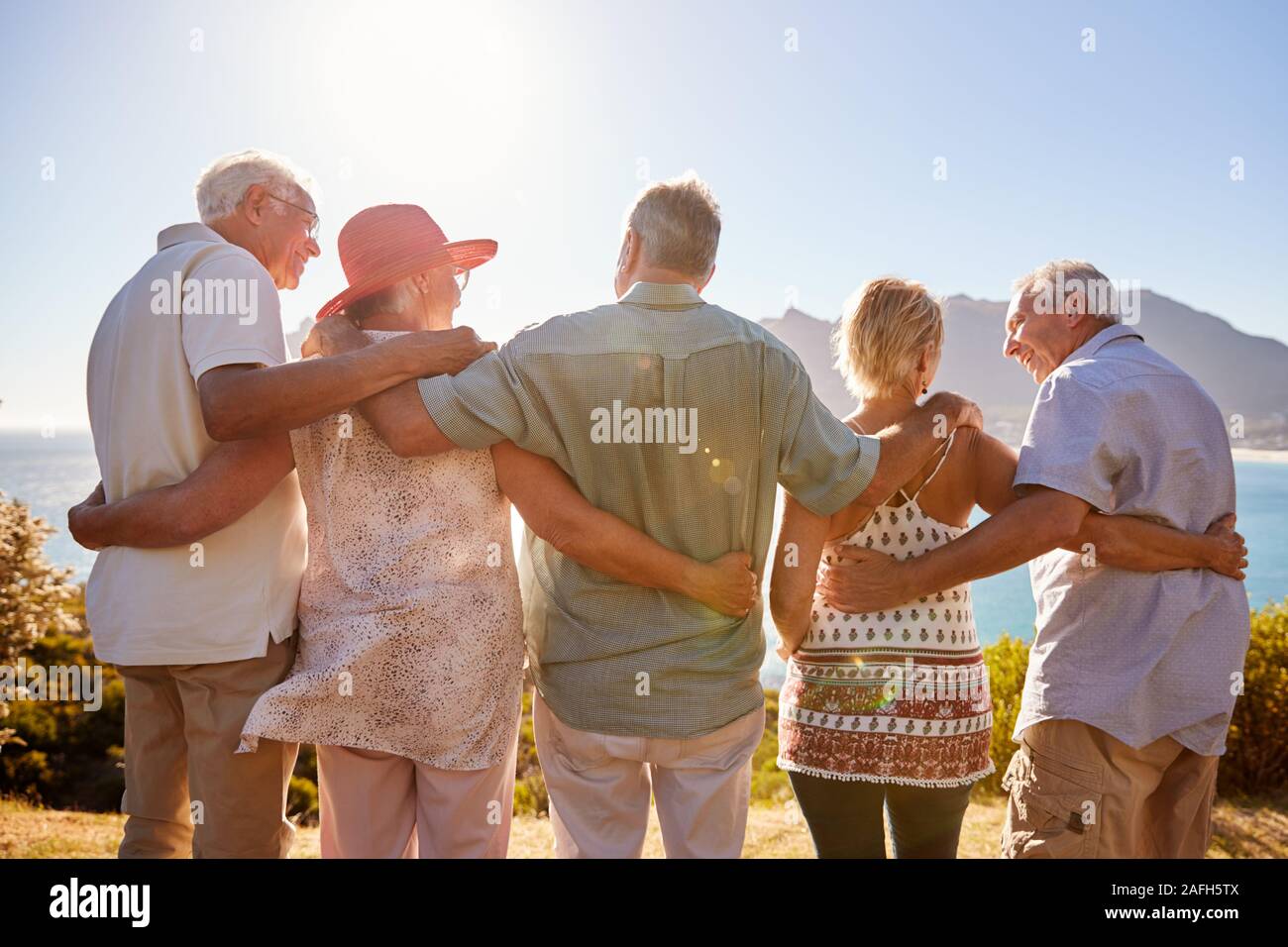 Rear View Of Senior Friends Visiting Tourist Landmark On Group Vacation ...