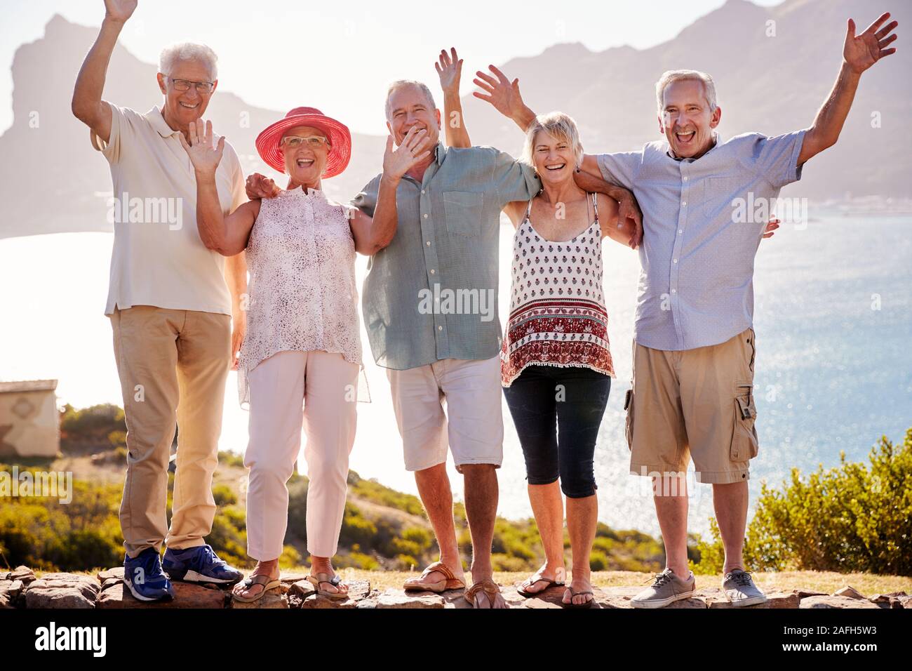Portrait Of Senior Friends Visiting Tourist Landmark On Group Vacation ...