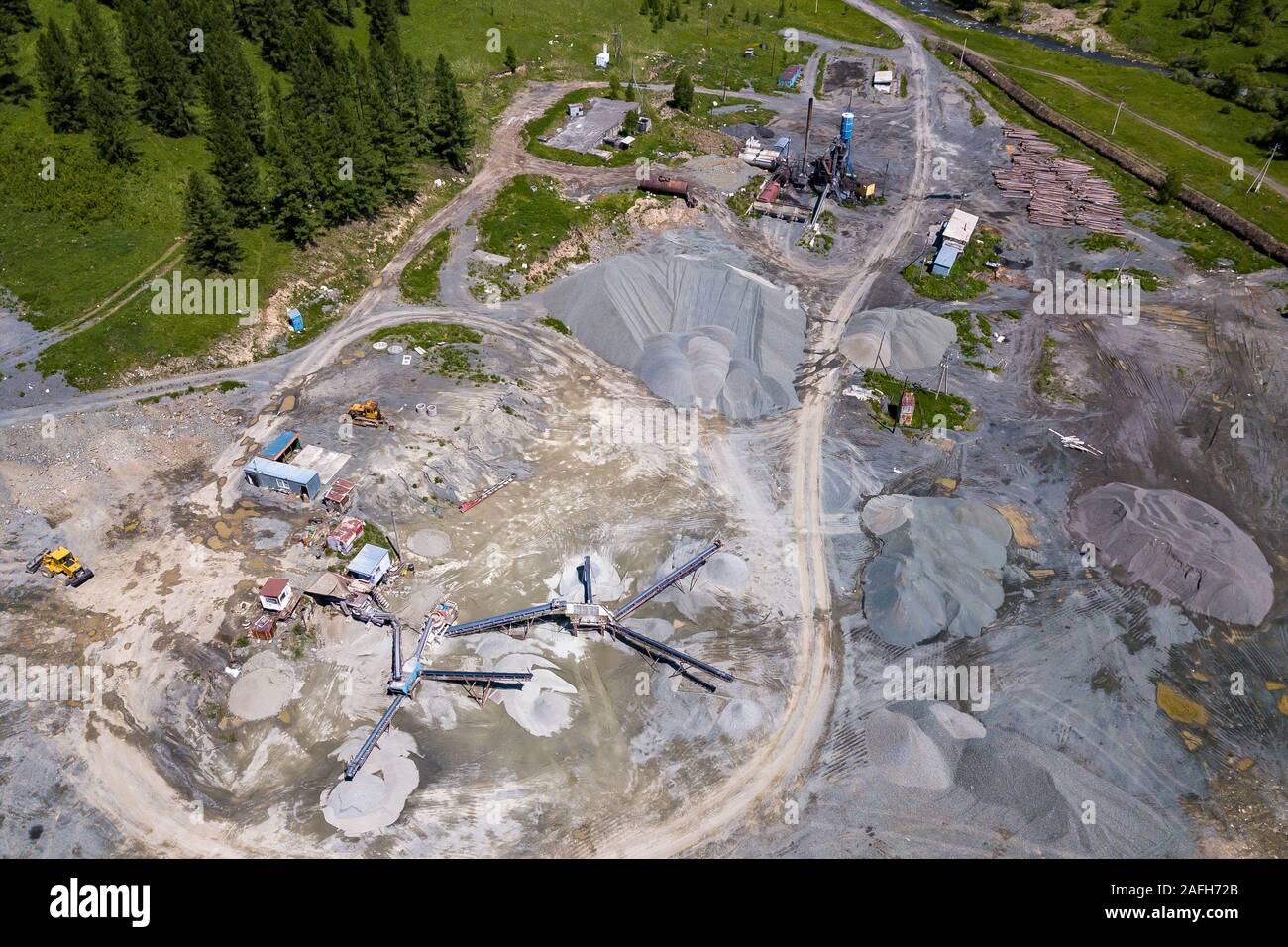 Aerial view of a small plant for the production and cleaning rubble and ...