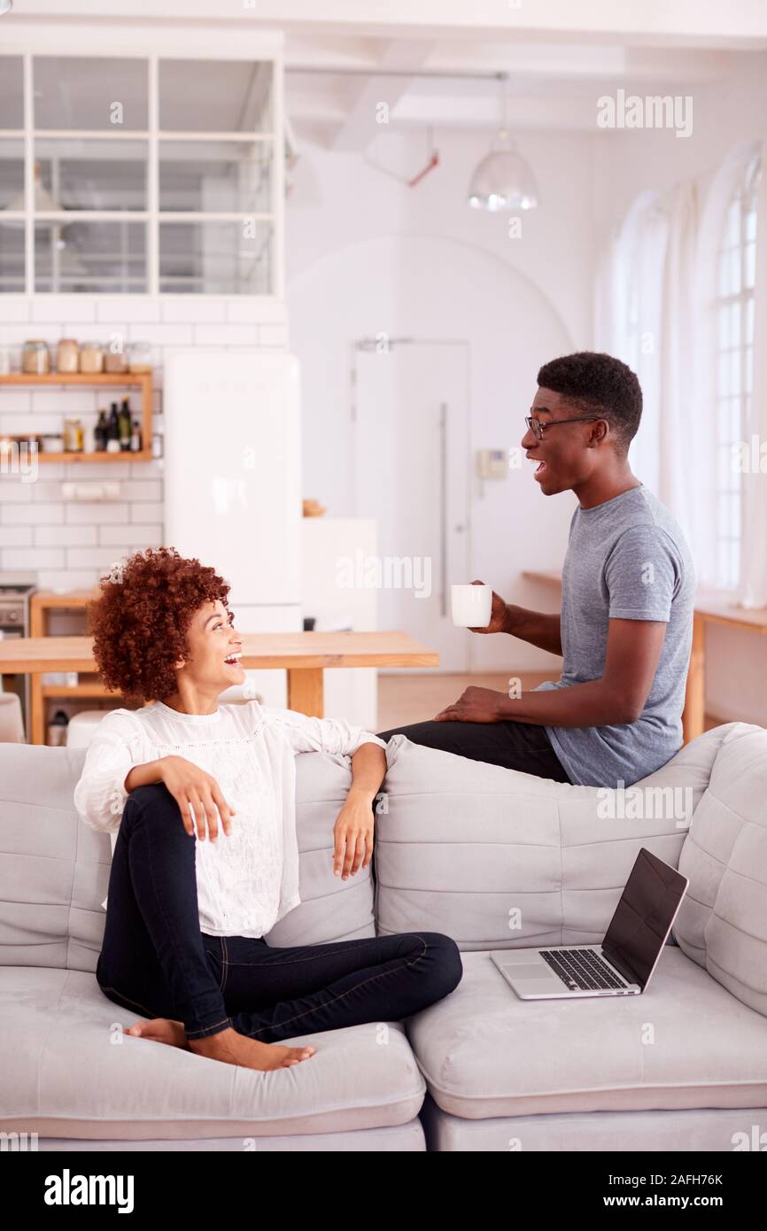 Male female couple 20s home sofa hi-res stock photography and images ...