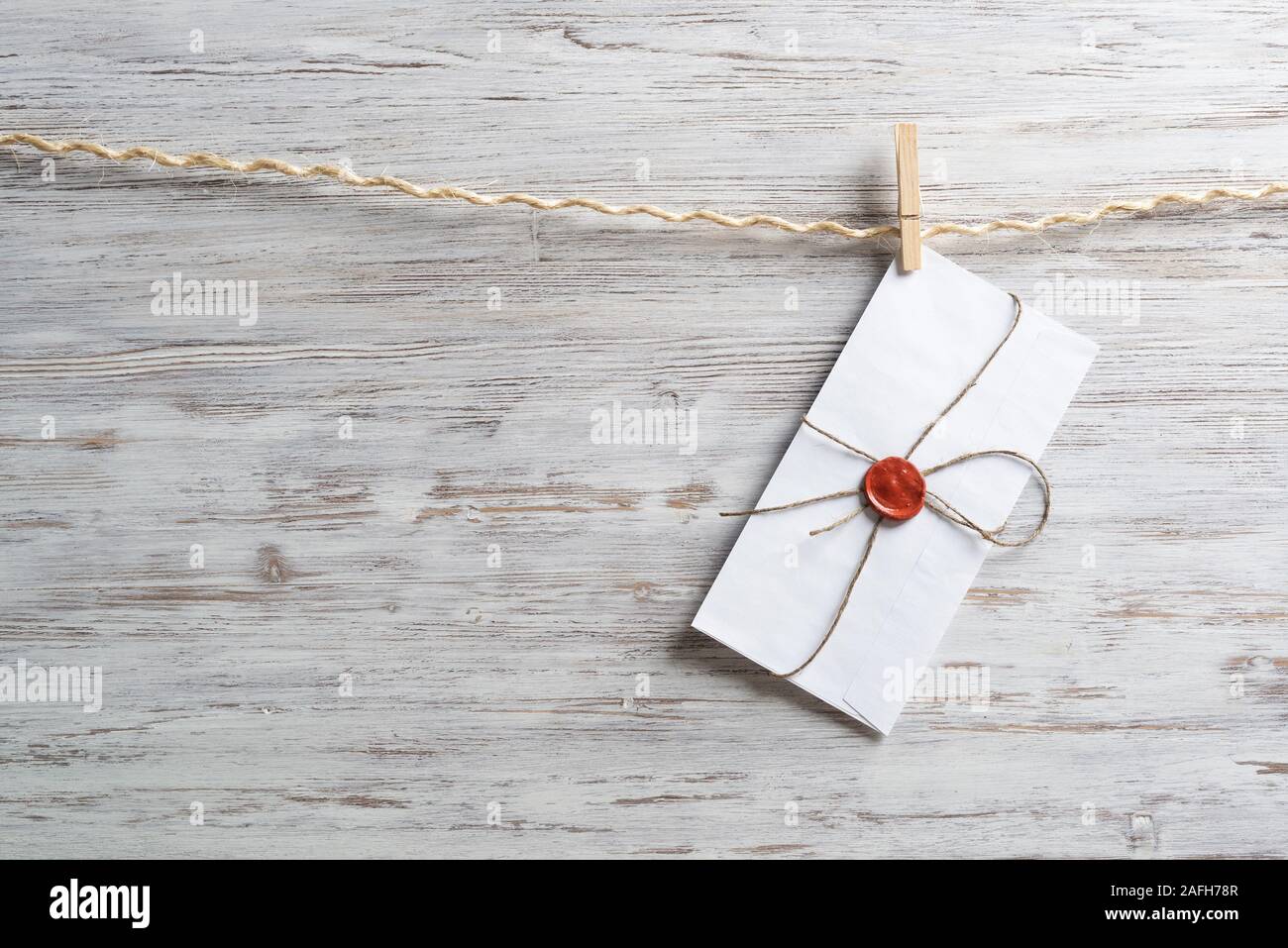Envelope hanging on rope hi-res stock photography and images - Alamy