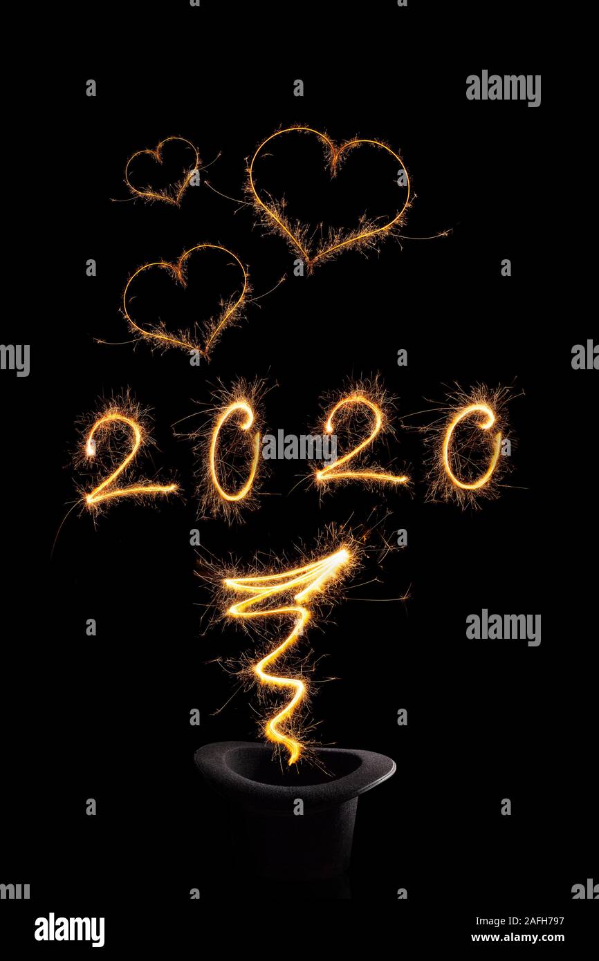 Magical happy new year. Magical fireworks from black top hat forming ...