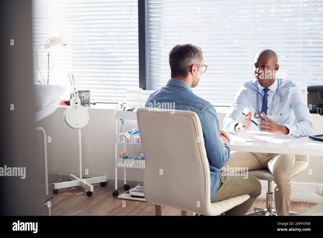 Doctor gp patient surgery hi-res stock photography and images - Alamy