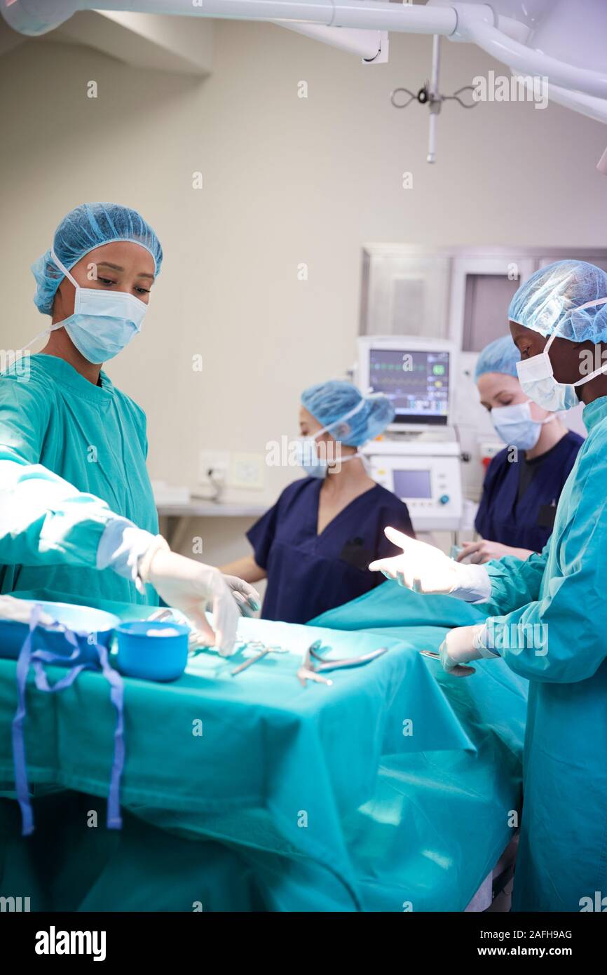 Surgical Team Working On Patient In Hospital Operating Theatre Stock ...