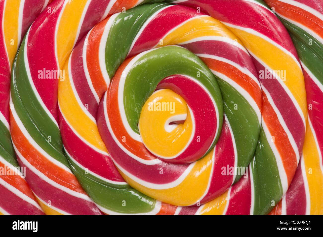 Colorful spiral shaped lollipop close-up and full-frame Stock Photo - Alamy