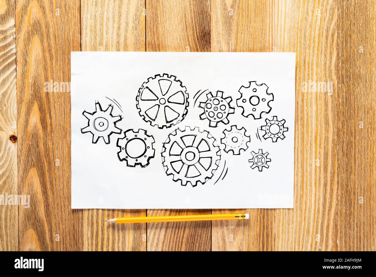 Group of rotating gears pencil hand drawn Stock Photo - Alamy