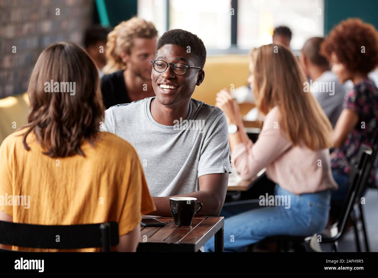 Couple sitting table hi-res stock photography and images - Alamy