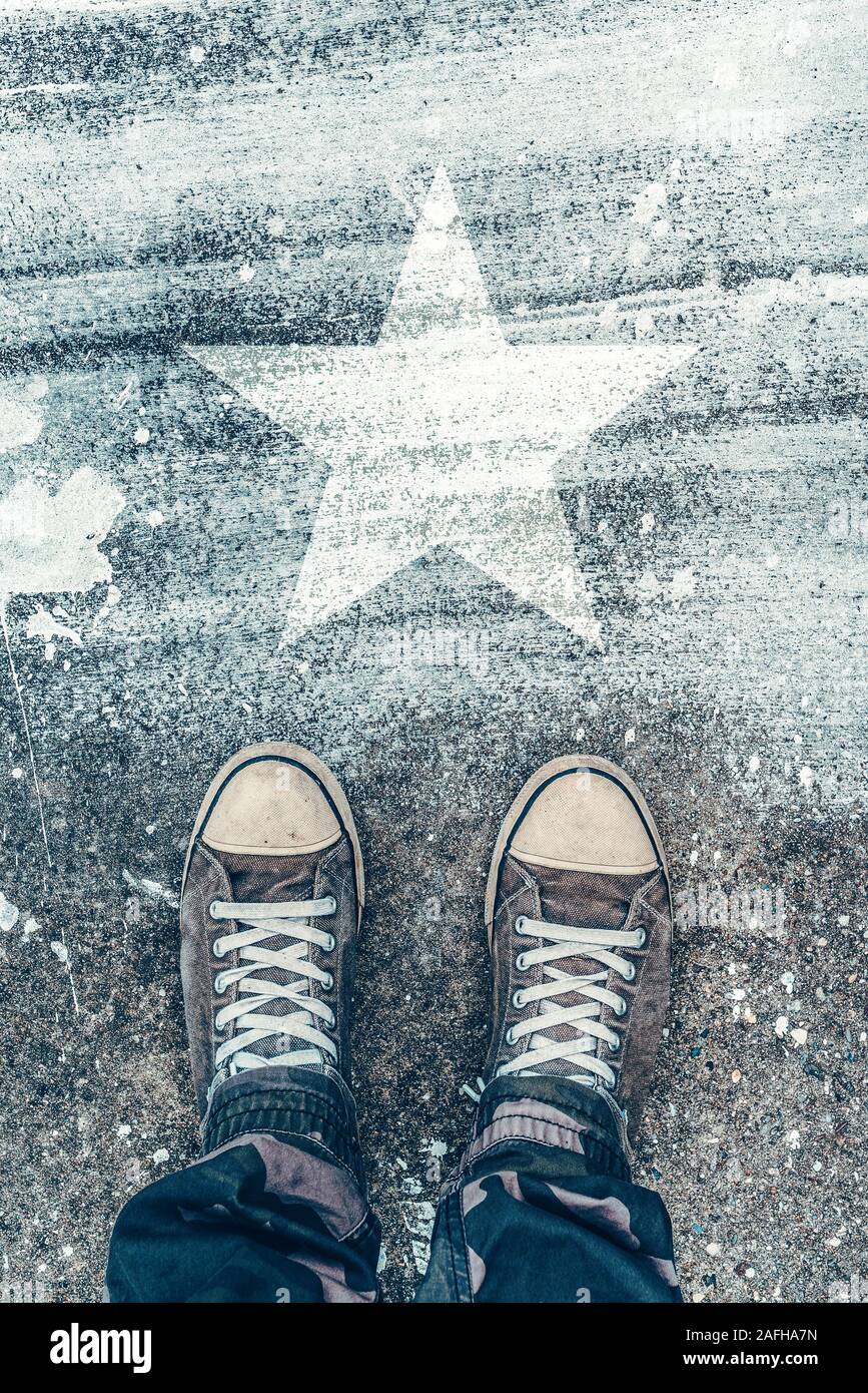 Standing on the road with star shape imprint - talent, vip, prize and ...