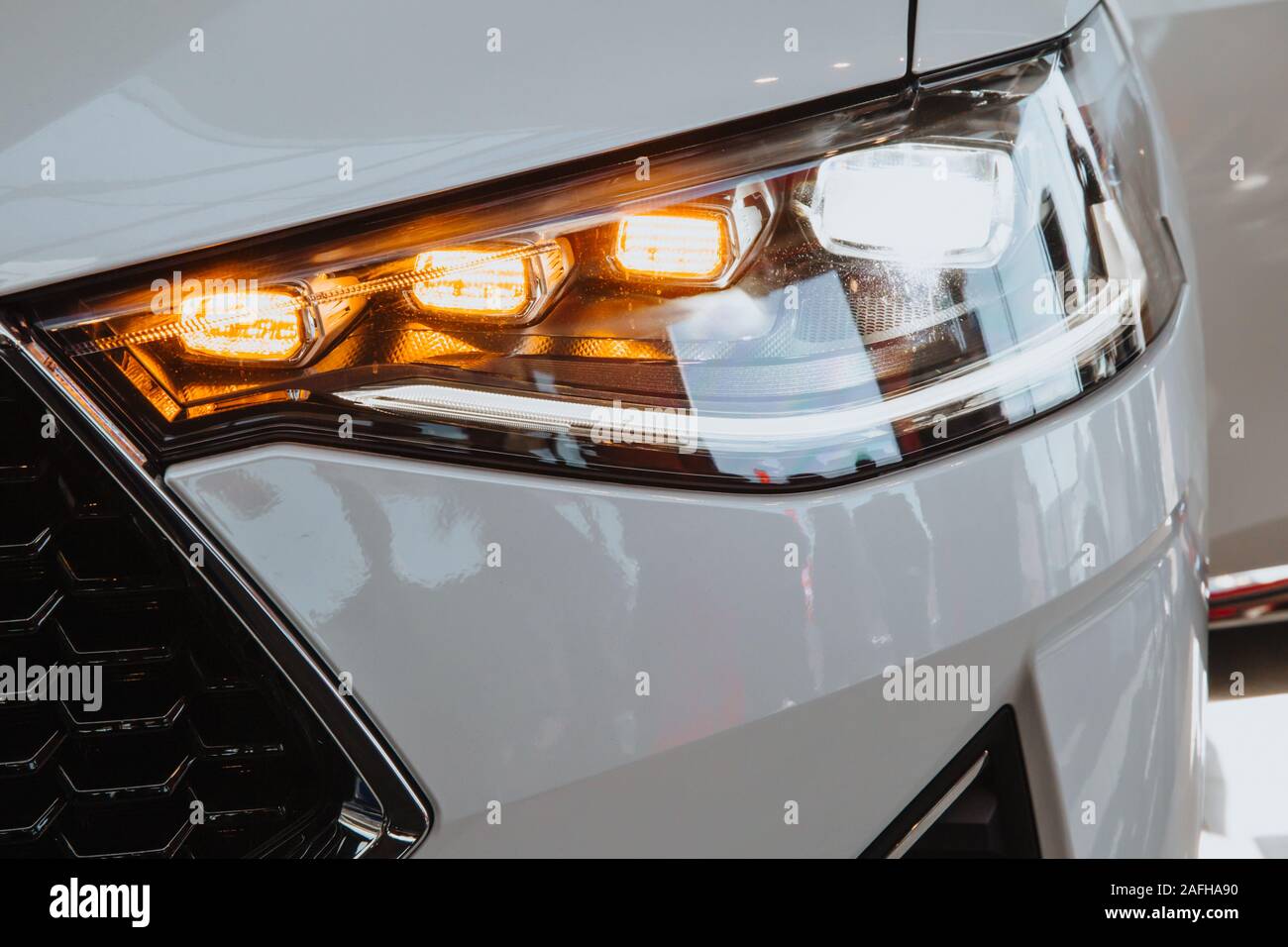 Headlight Of A Modern Car. The car is white Stock Photo - Alamy