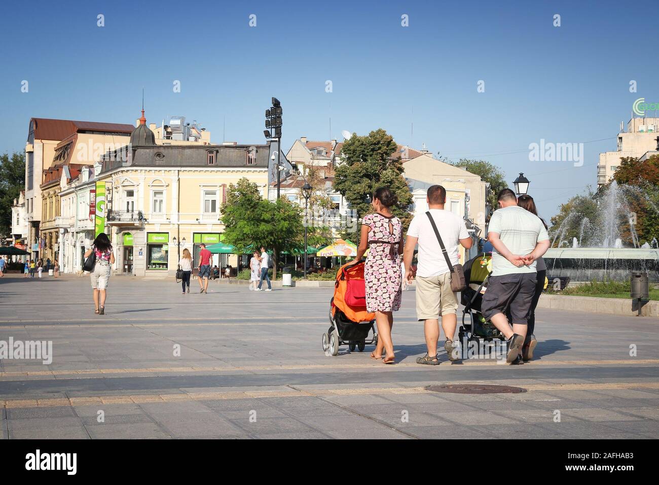ROUSSE, BULGARIA - AUGUST 18, 2012: People visit the main square in ...