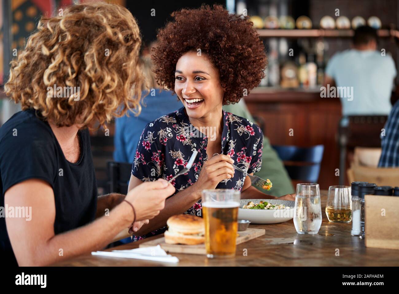 Romantic couple eating lunch table hi-res stock photography and images ...