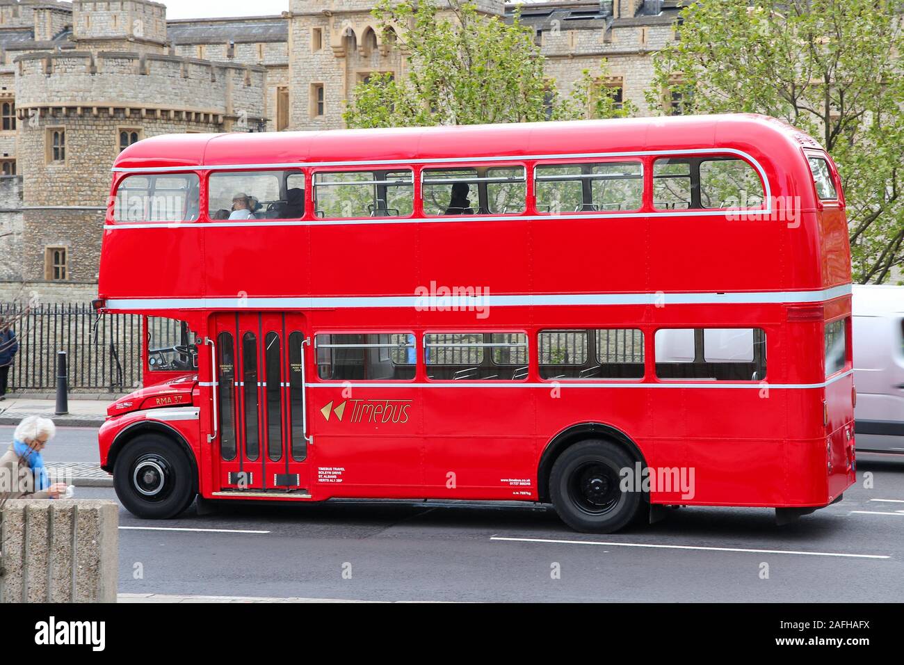 LONDON, UK - MAY 15, 2012: People ride old Routemaster red double ...