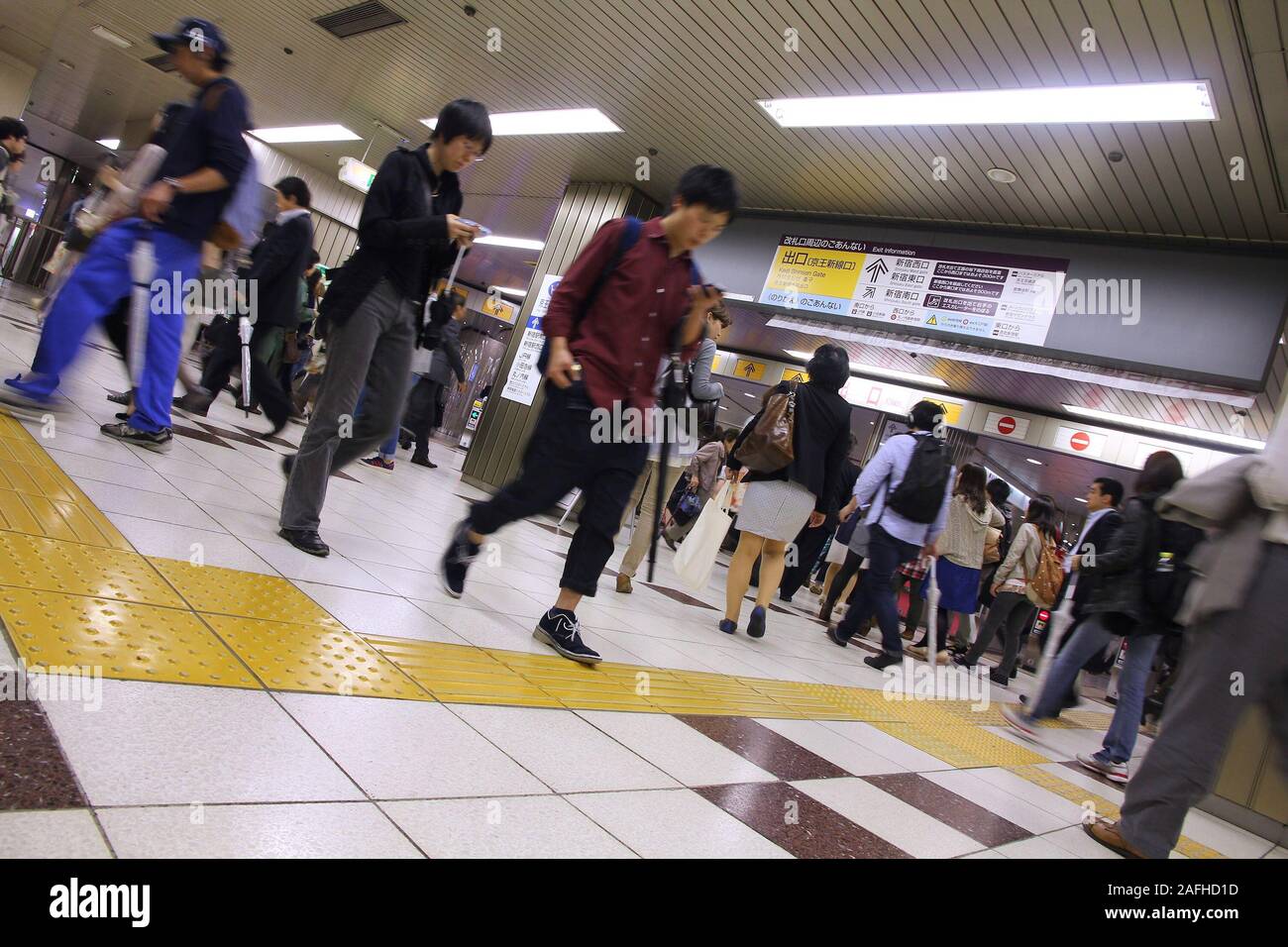 TOKYO, JAPAN - MAY 9, 2012: People enter Tokyo Metro station. With more ...