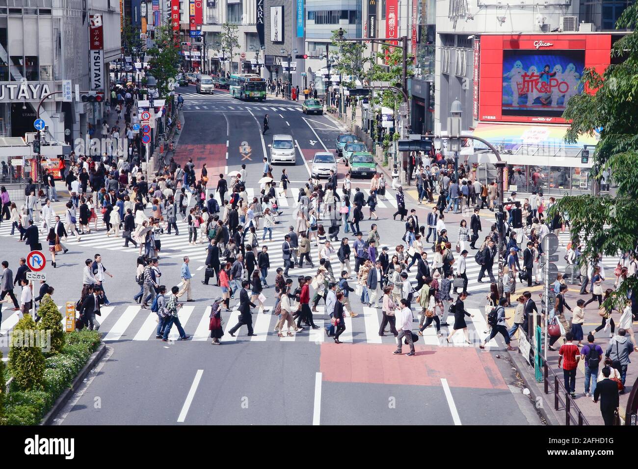 TOKYO, JAPAN - MAY 11, 2012: People walk the Hachiko crossing in ...